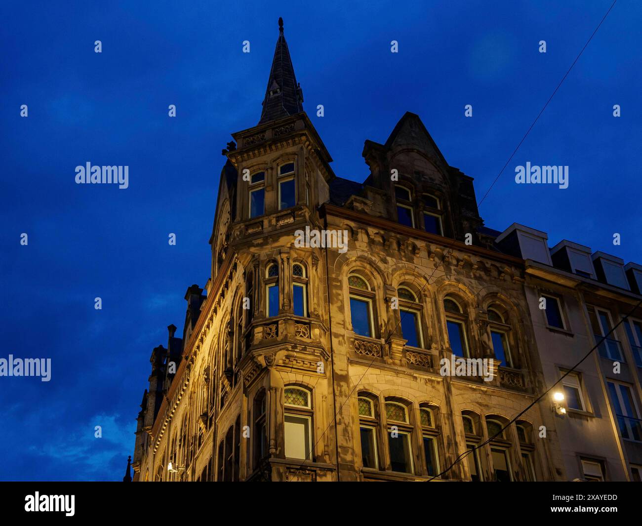 Historic building at night with lighting under a deep blue sky, Ghent ...