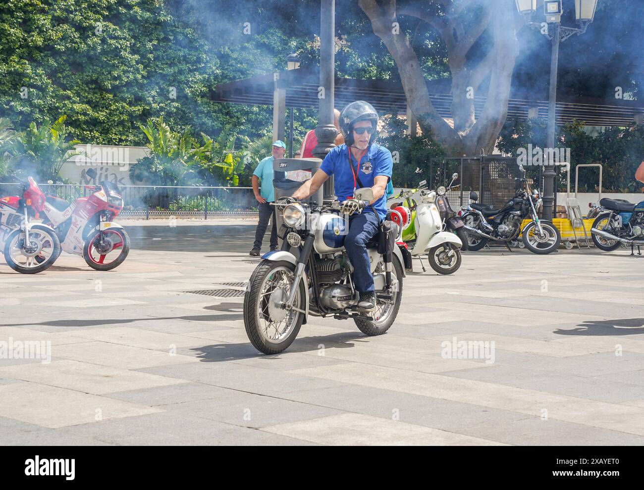 Man riding a classic Bultaco motorcycle at an annual Classic motorcycle ...