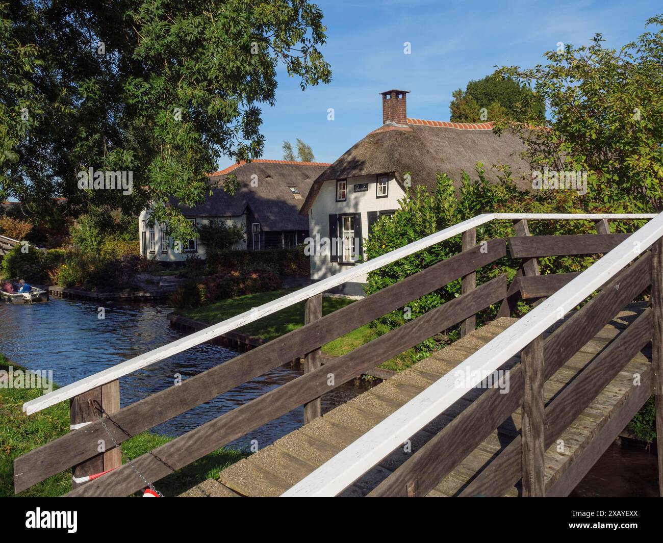 Traditional thatched roof houses surrounded hi-res stock photography ...