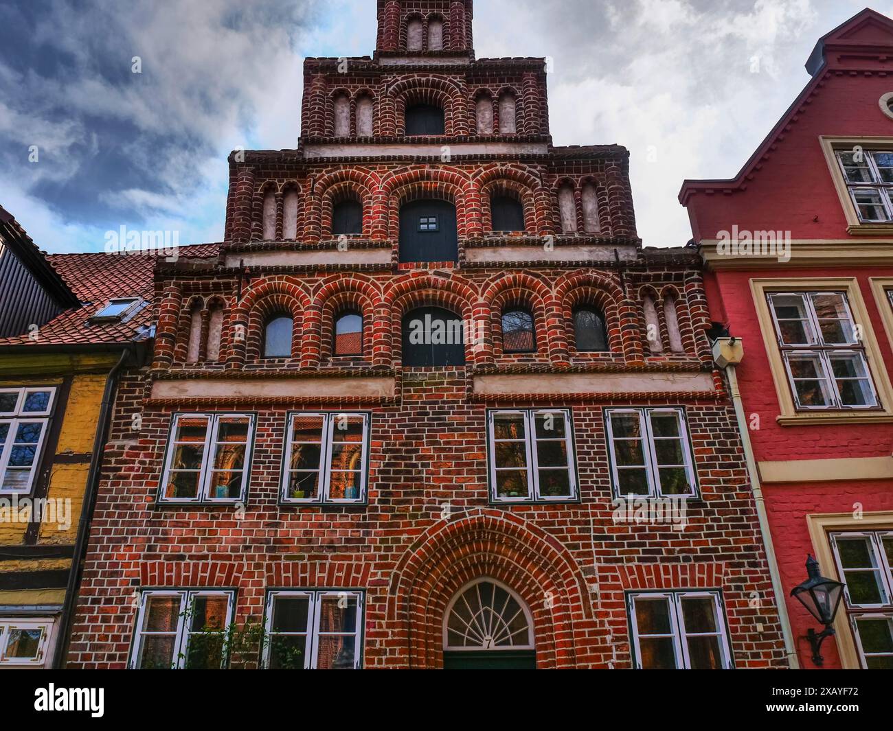 Historic, ornate brick building with numerous windows and gables under ...