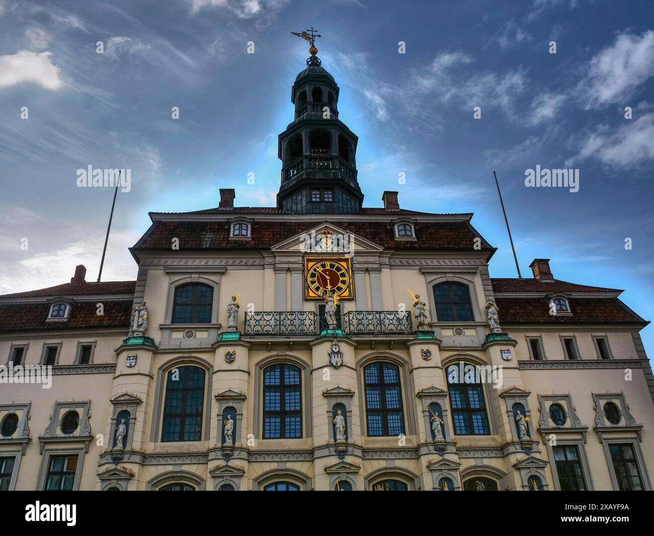 The picture shows a large, historic building with a high, ornate tower ...