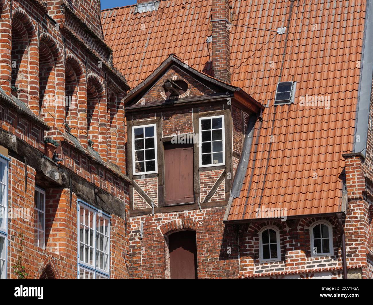 Detail of historic brick architecture with windows and doors in gable ...