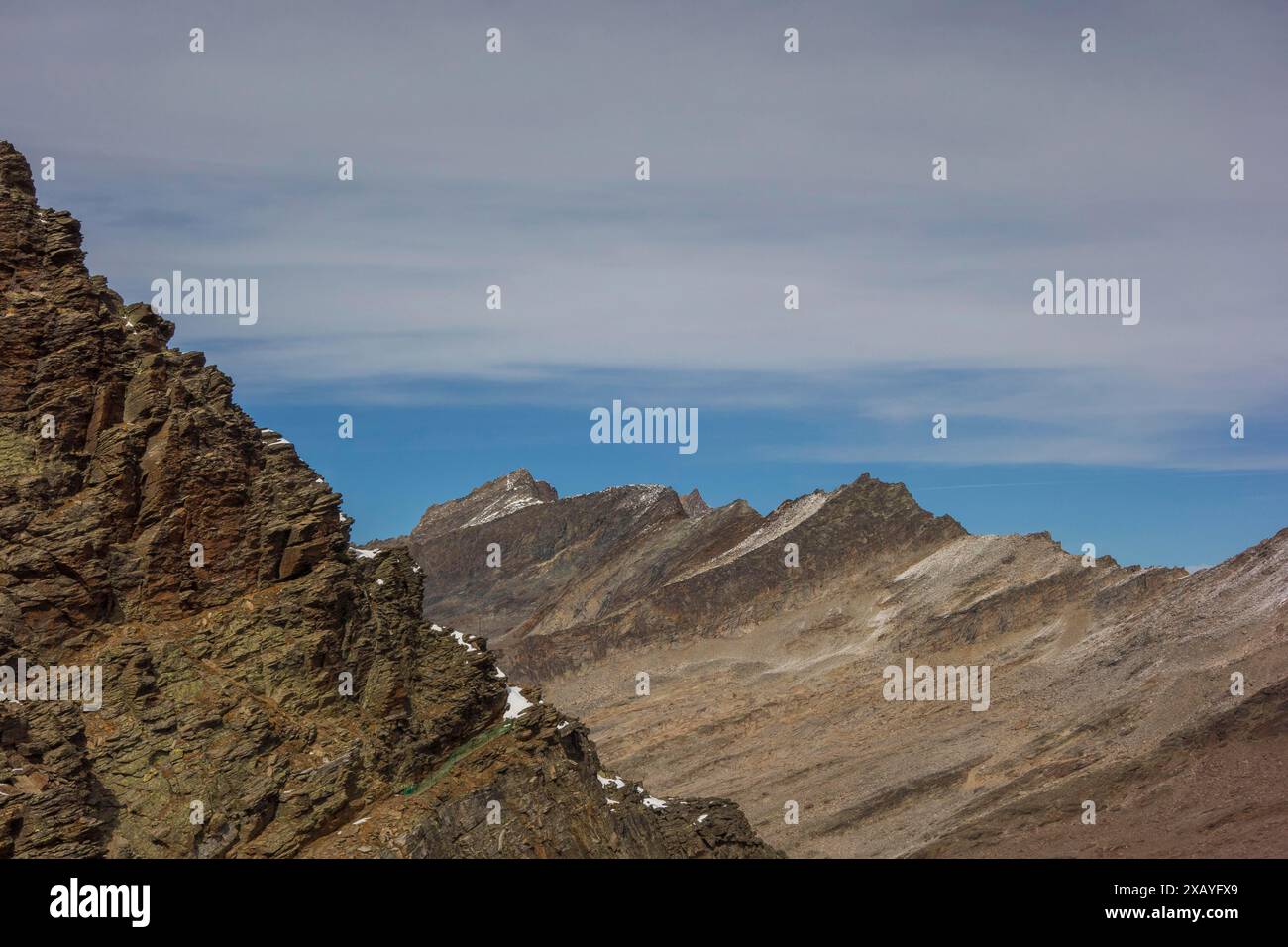 Rough mountain landscape with clear peaks under a blue sky, Saas Fee ...