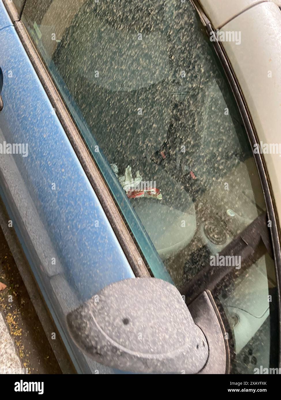 Cremona, Italy - June 9th 2024 Dusty blue car parked in a desert lot ...
