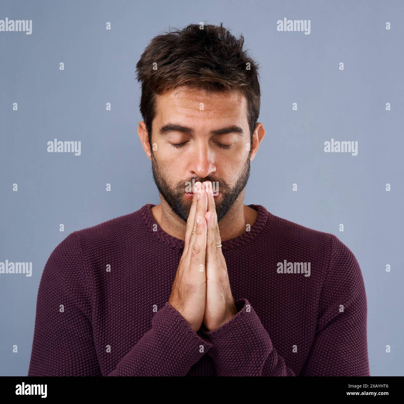 Spiritual, faith and man in studio, praying and hands for miracle of ...