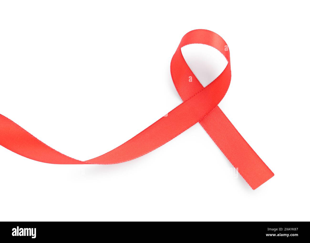 Red awareness ribbon isolated on white, top view Stock Photo - Alamy