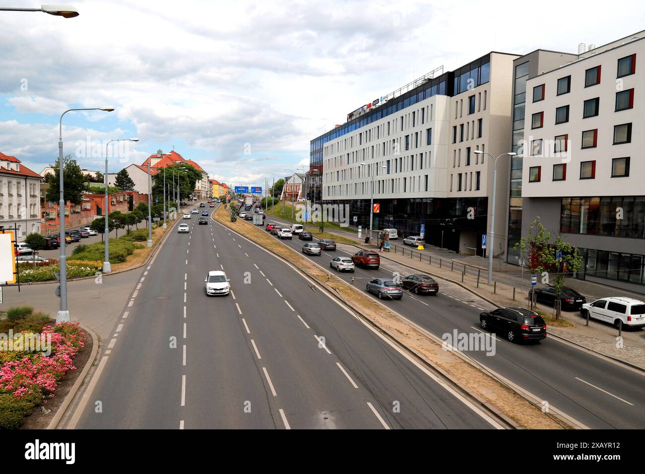 Traffic jam on highway. Cars and trucks drive along the multi lane road ...