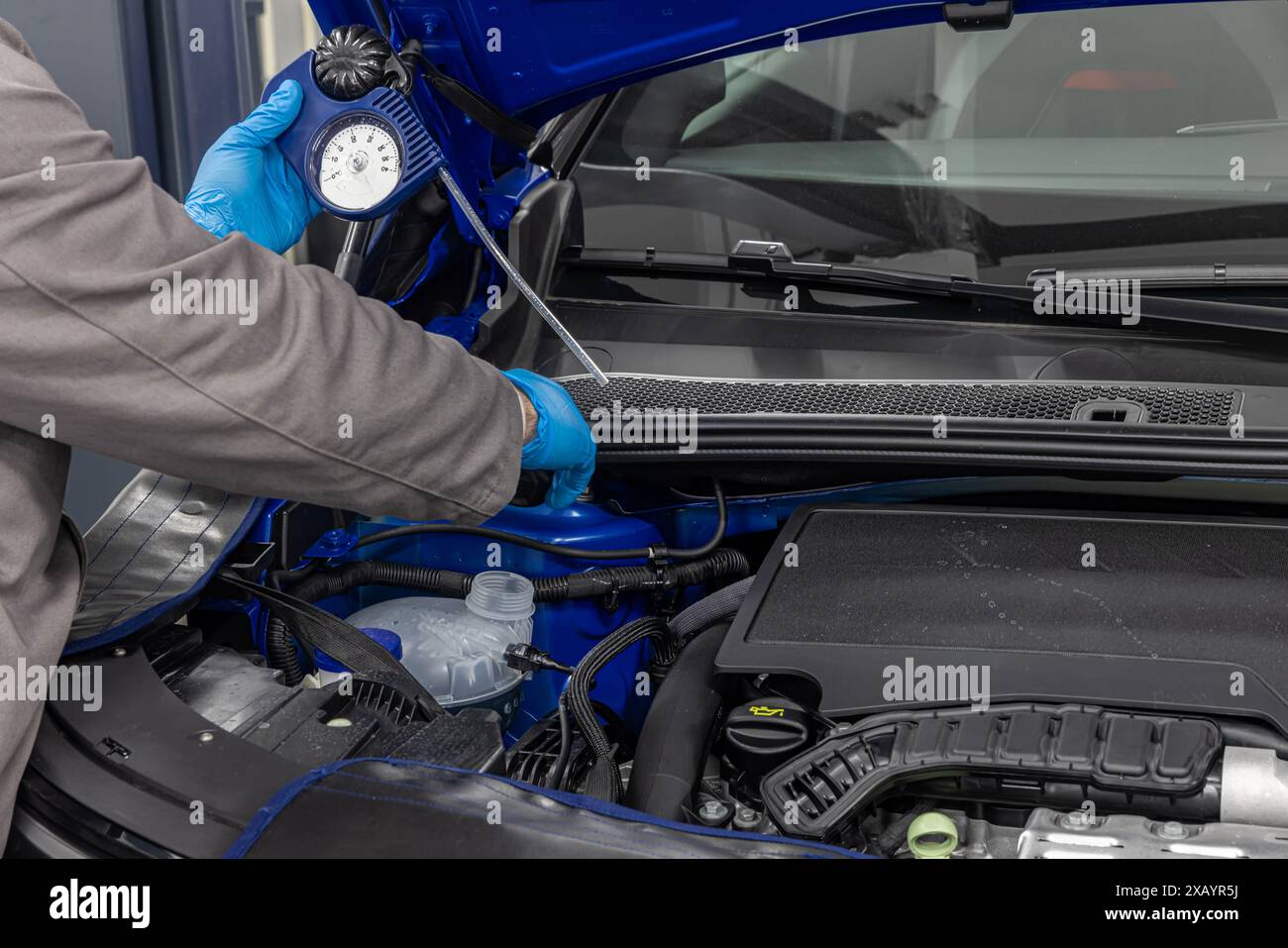 Car winter maintenance antifreeze control. Automobile mechanic tests ...