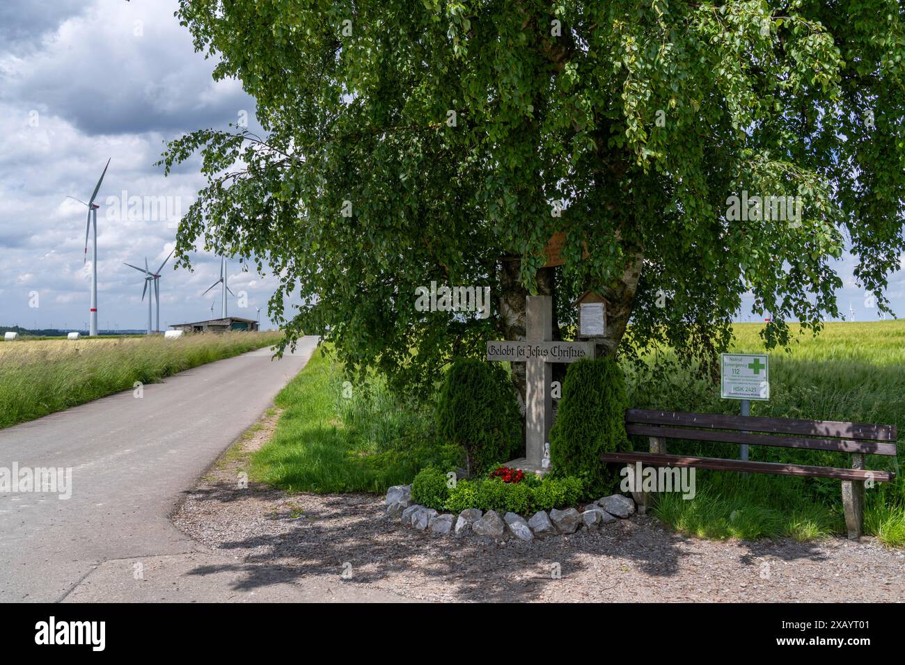 Wind farm north of Marsberg, wayside cross, park bench and emergency ...