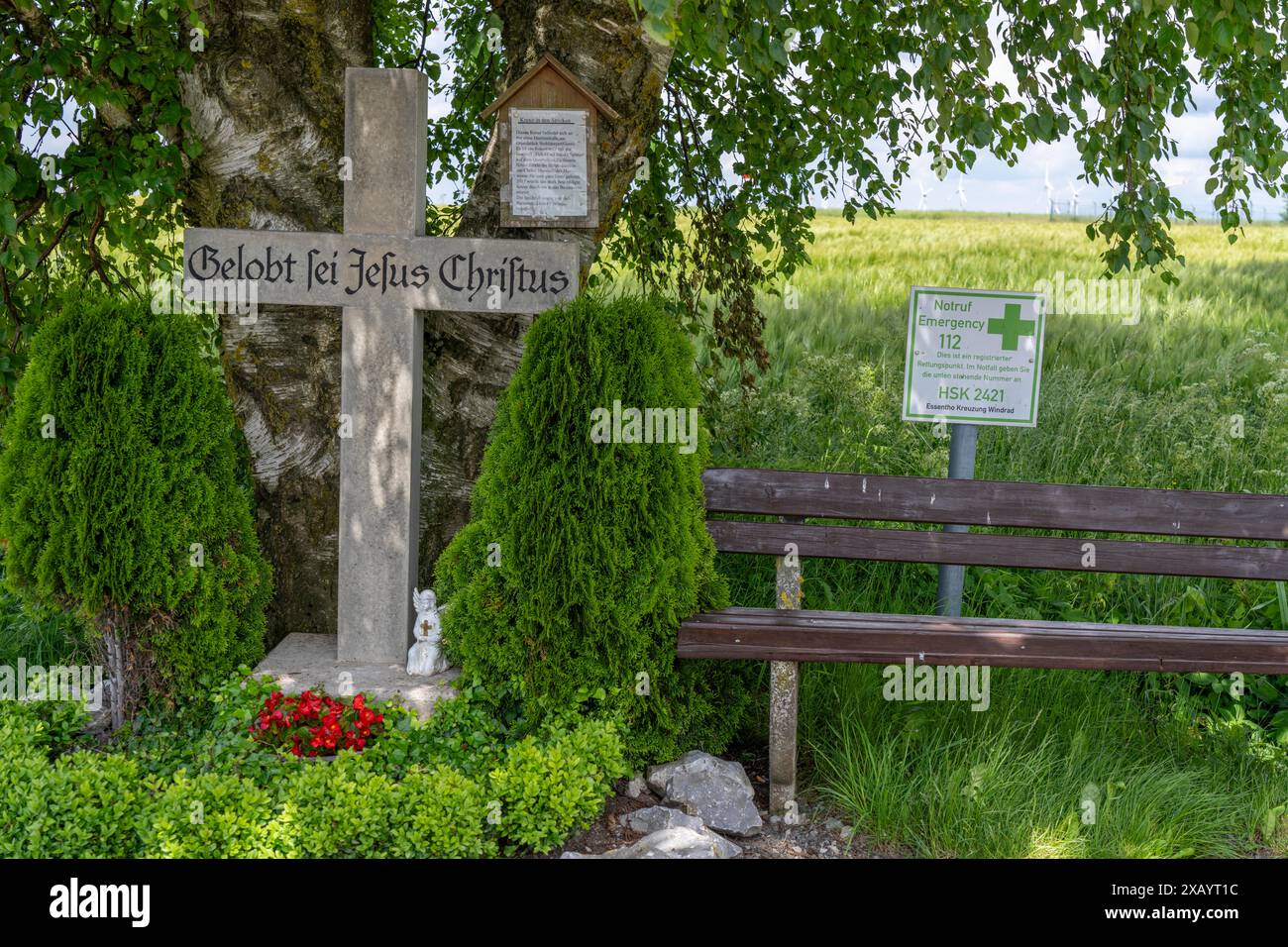 Wind farm north of Marsberg, wayside cross, park bench and emergency ...