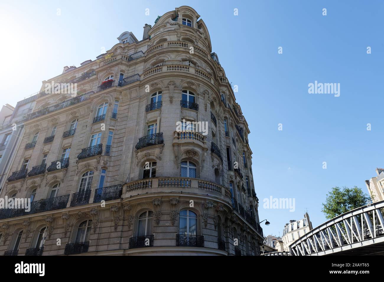 The facade of traditional French house with typical balconies and ...