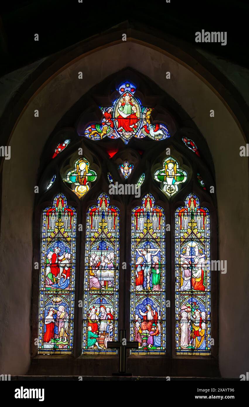 Colorful stained glass window depicting various religious scenes in a ...