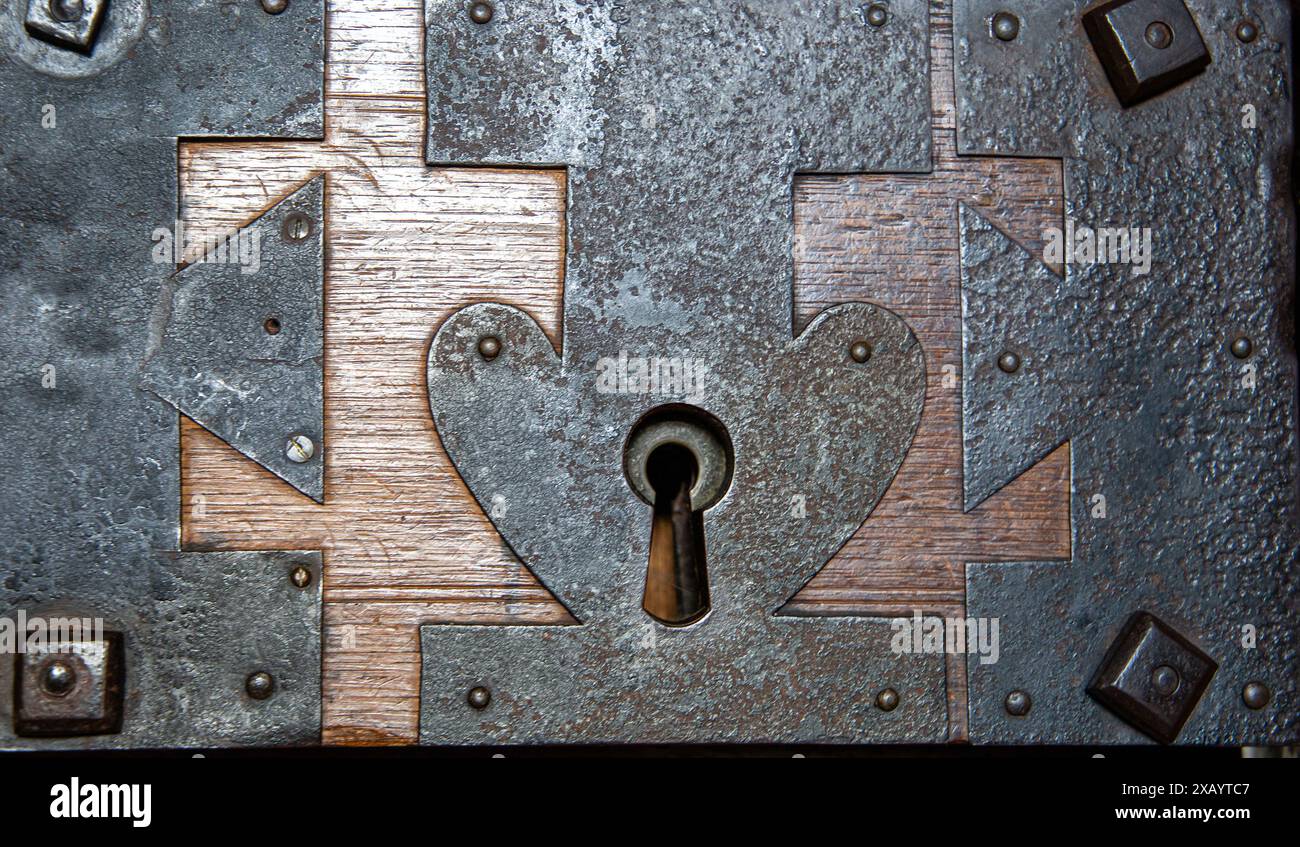 Close-up of an antique lock with intricate metalwork and wood inlay ...