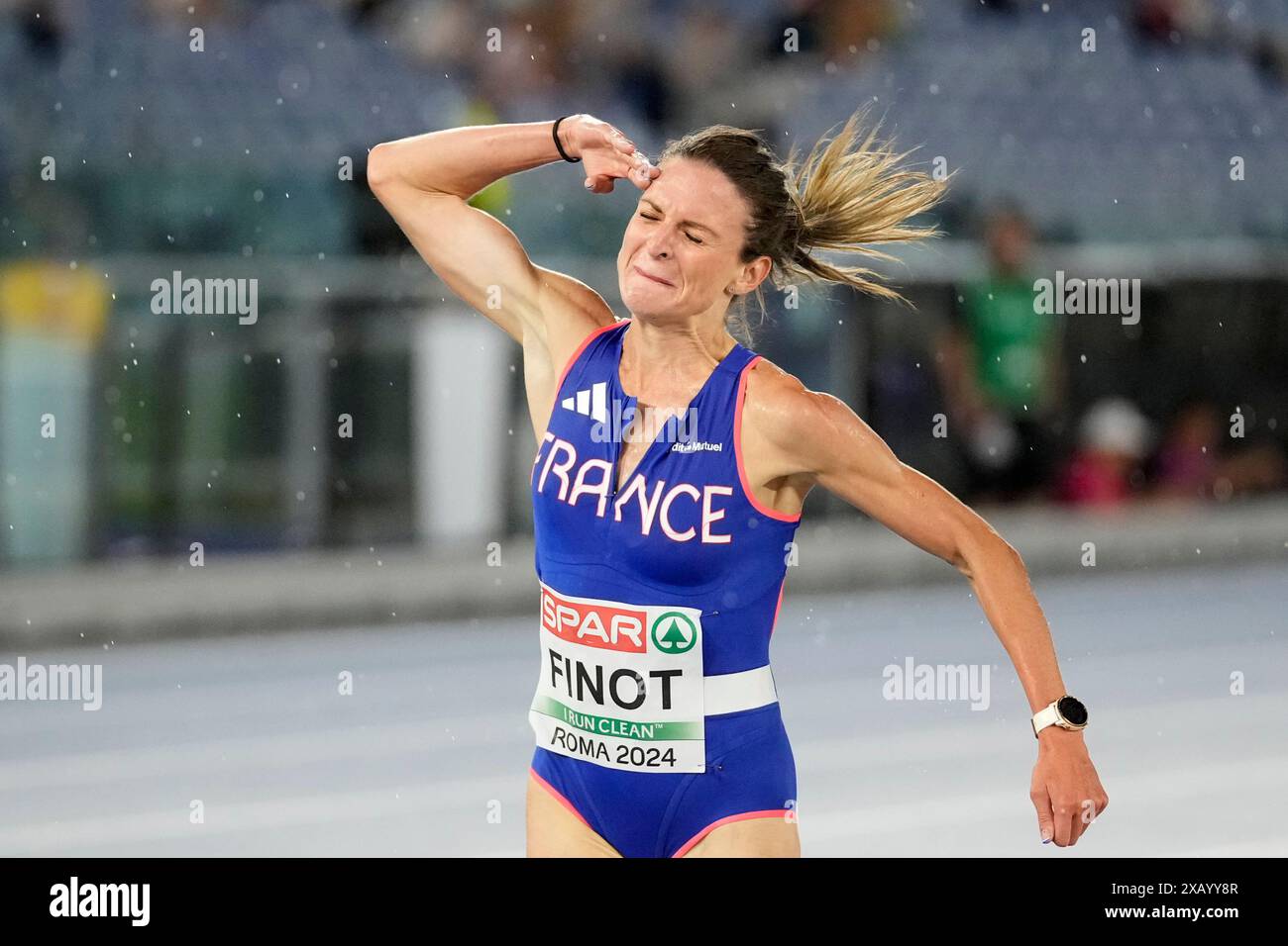 Alice Finot, of France, crosses the finish line to win the gold medal ...