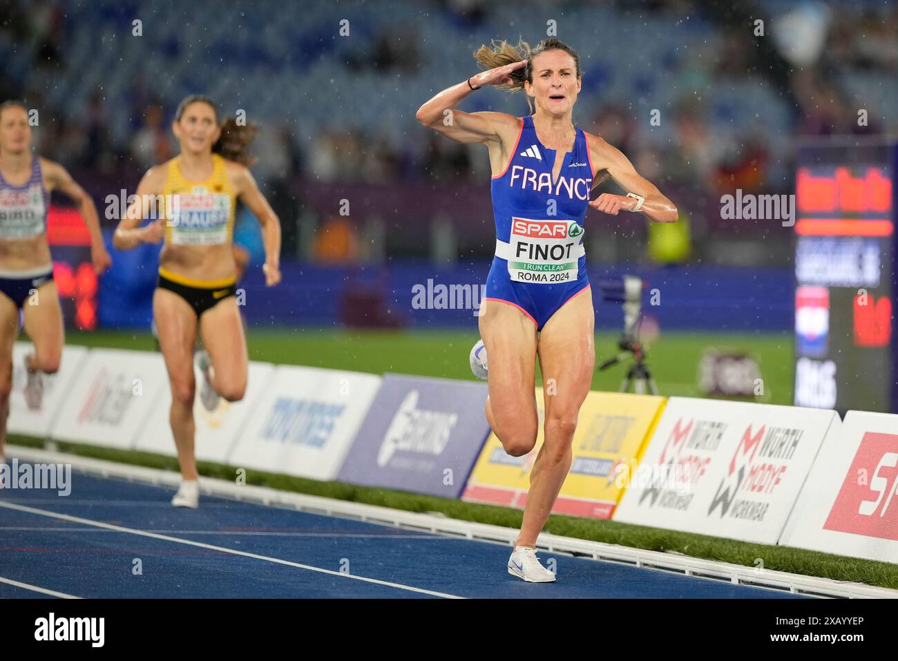 Alice Finot, of France, right, reacts as she races to win the gold ...
