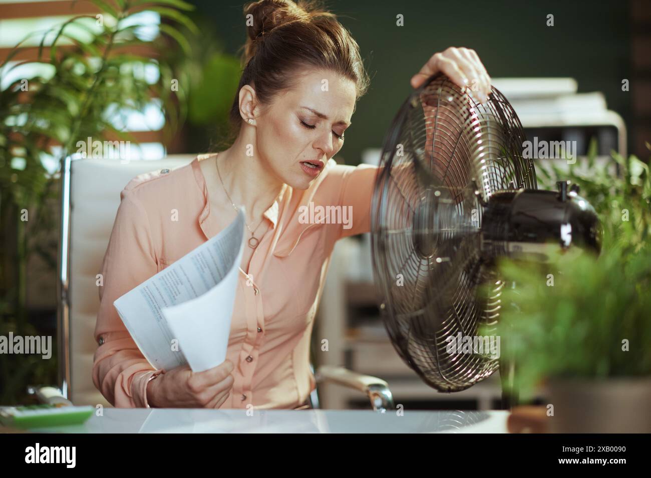 Sustainable workplace. modern 40 years old woman employee in modern ...