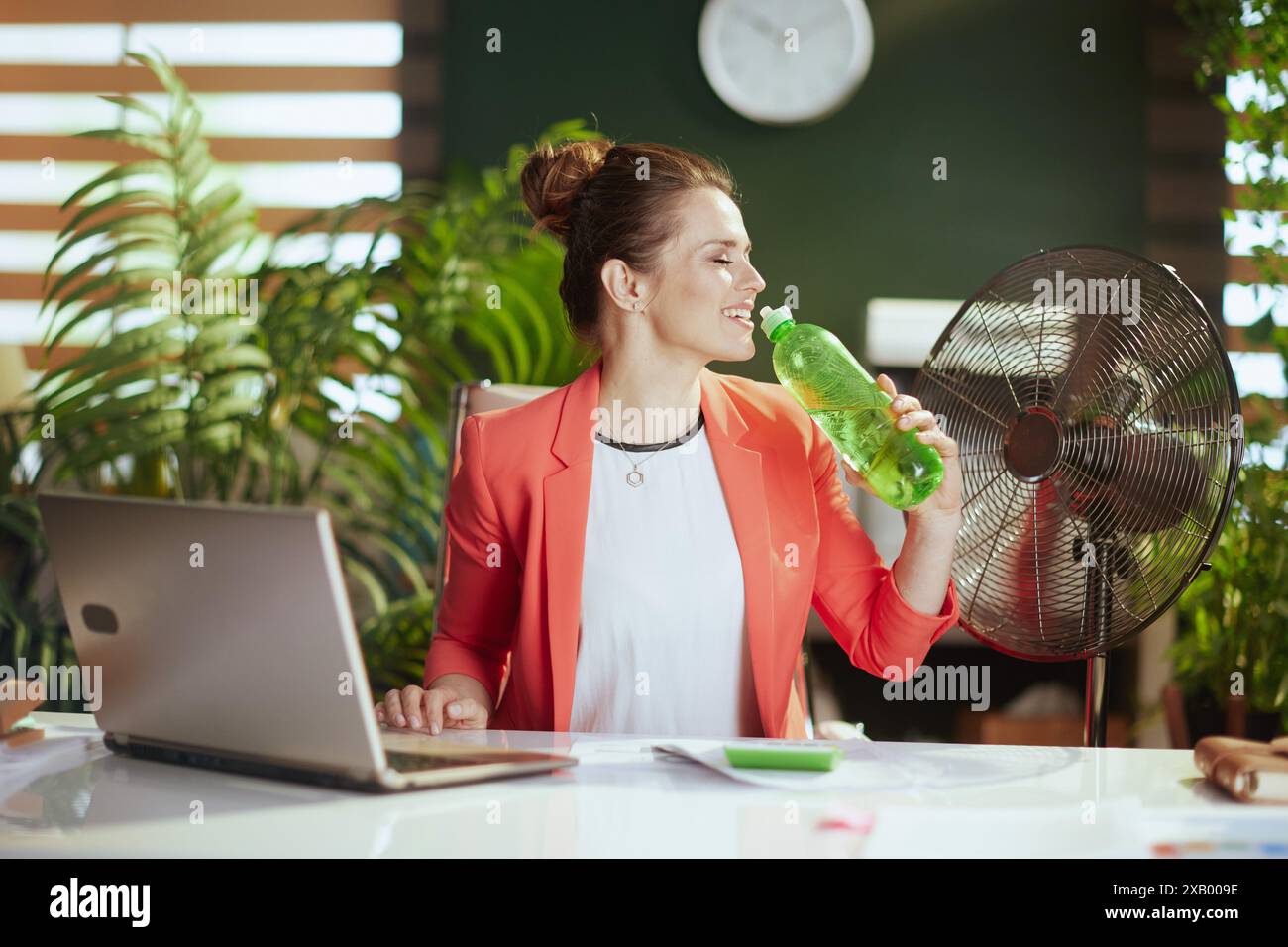 Sustainable workplace. happy modern small business owner woman at work ...