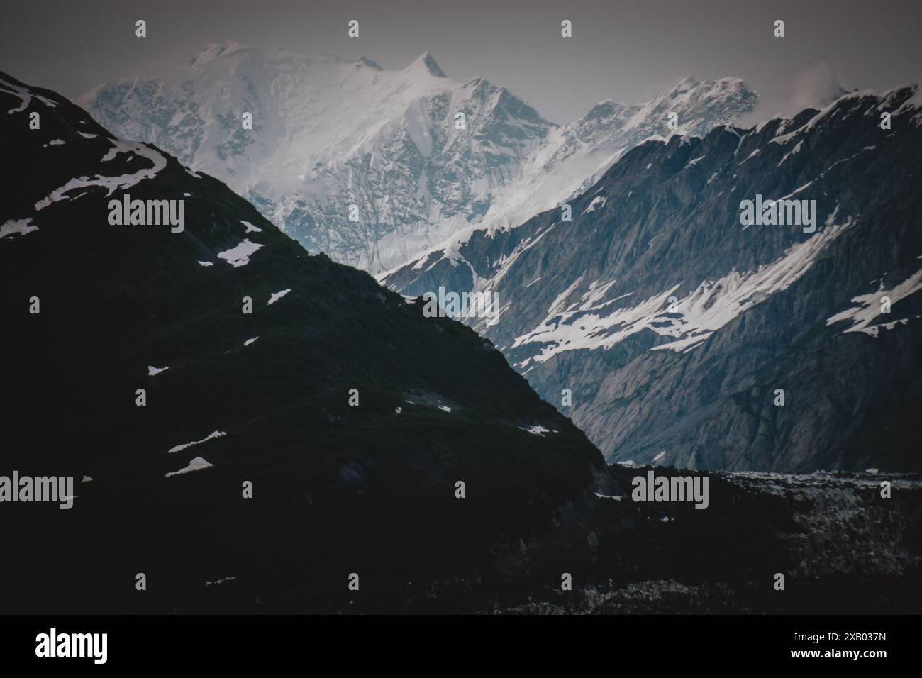 A breathtaking view of Alaskan mountain peaks with snow-capped summits ...