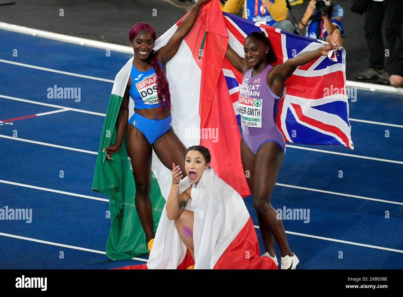 Silver medalist Ewa Swoboda, of Poland, center, bronze medalist Zaynab ...