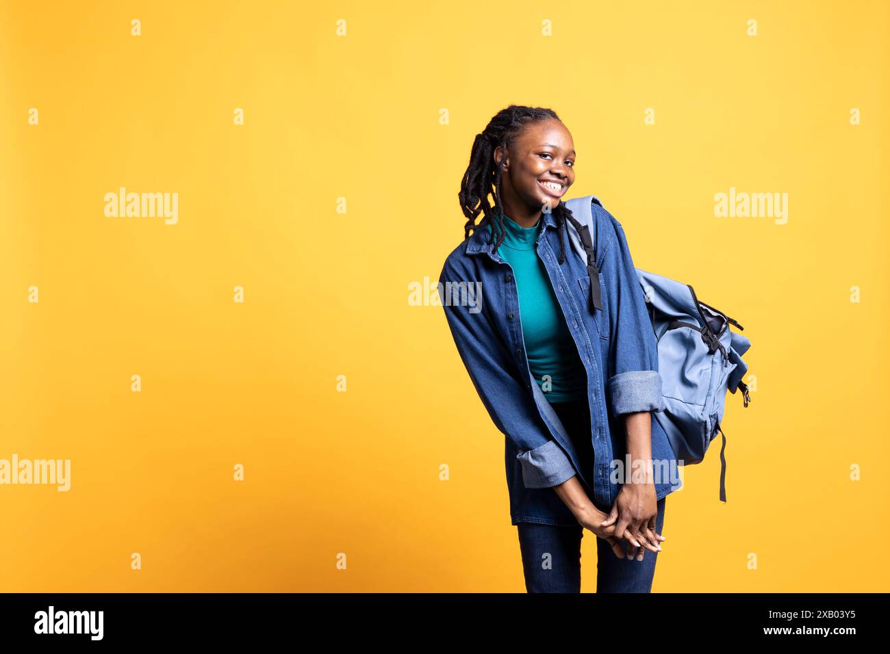 Upbeat african american teenager in giddy stance feeling joyous ...