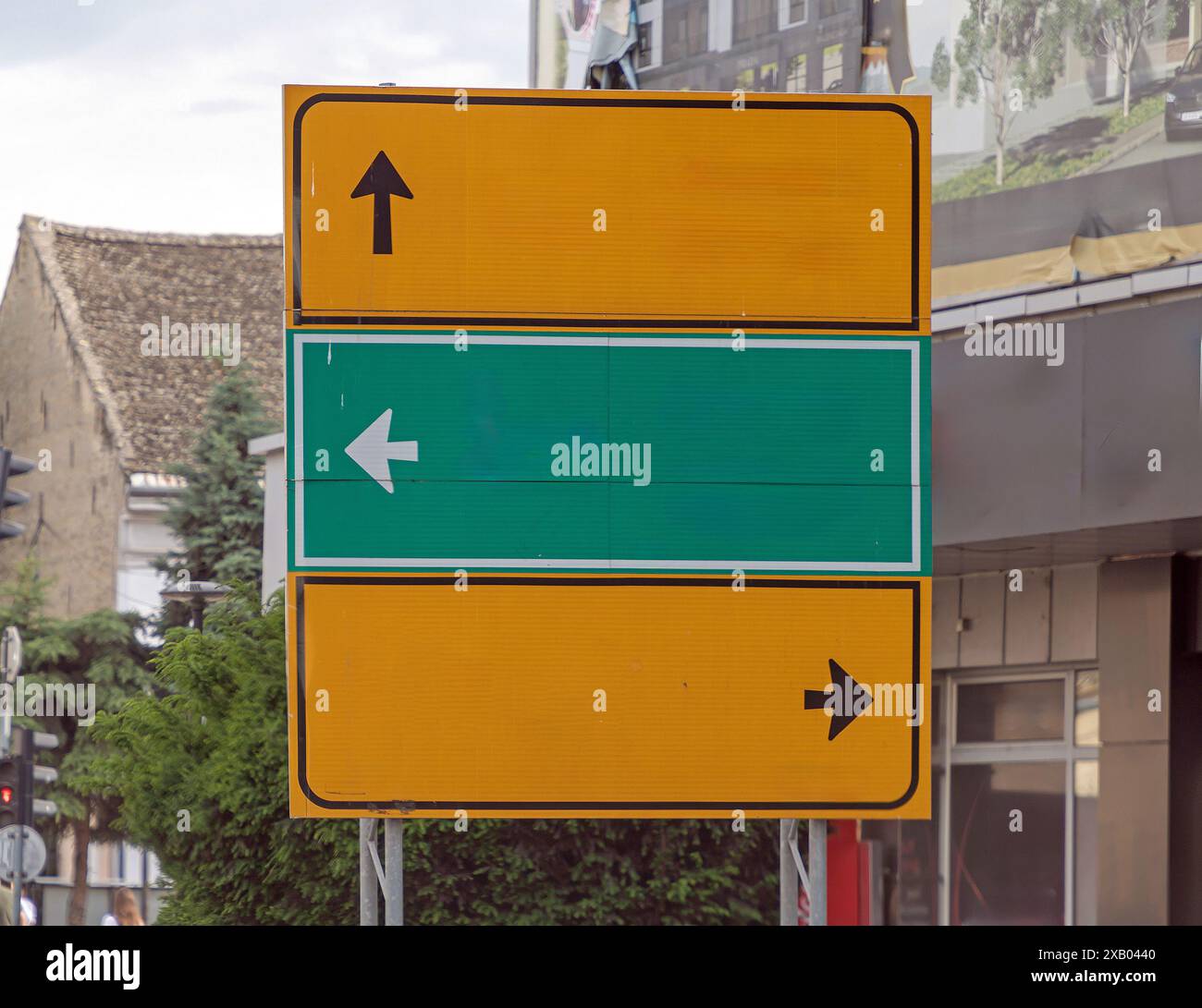 Traffic road signs with arrows for transition direction outside on a ...