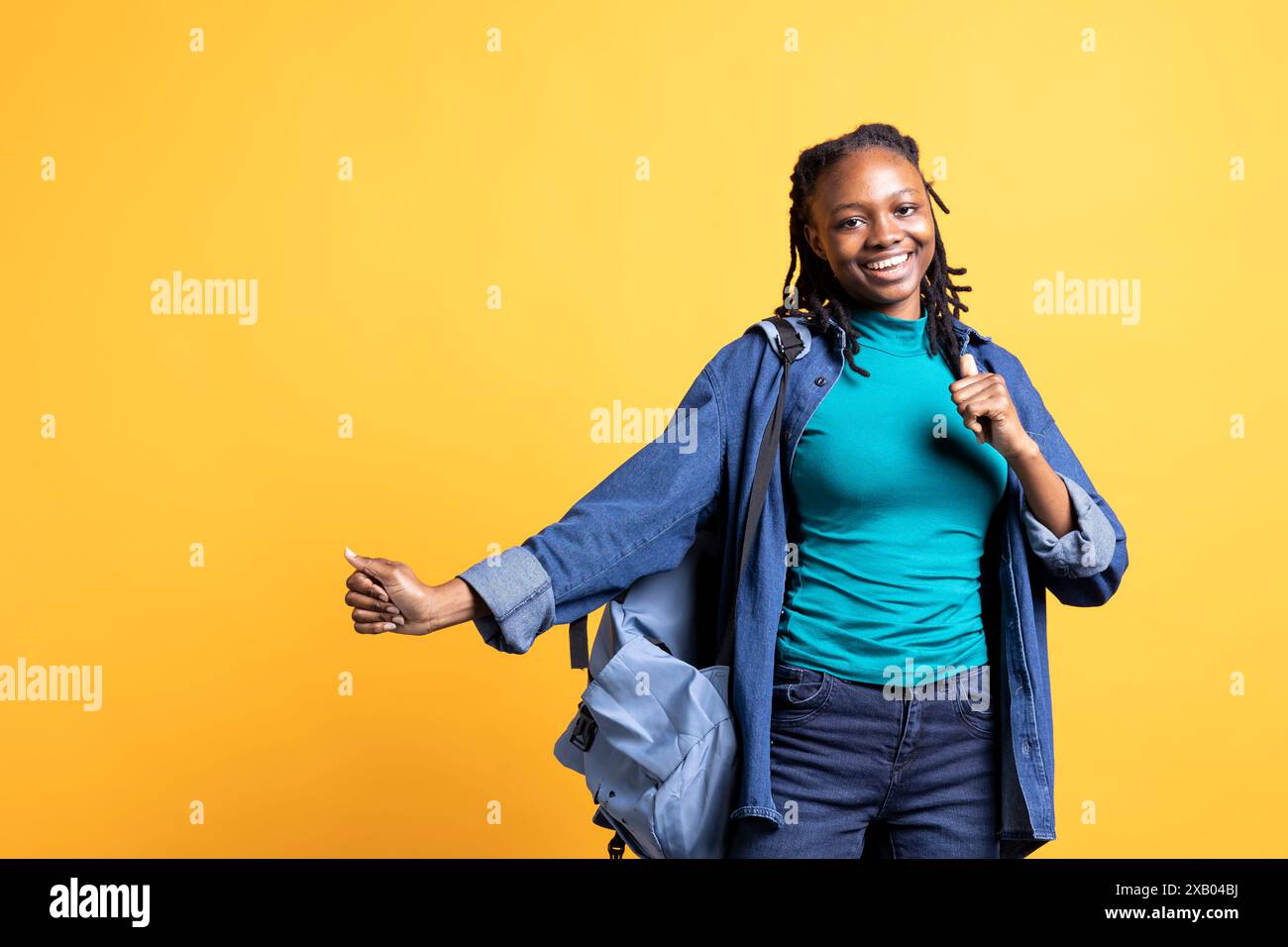 Smiling african american teenager having fun, dancing on rhythm ...