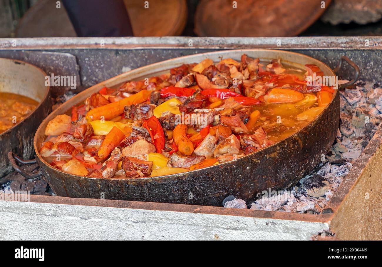 Cooked stew with vegetable and meat outside on agricultural fair Stock ...