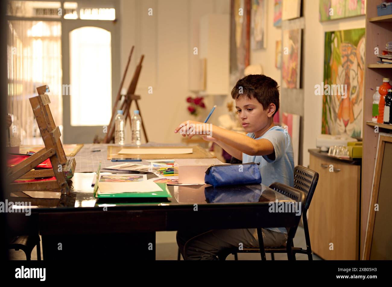 Kids have art class, drawing, painting with teacher in workshop. Young ...