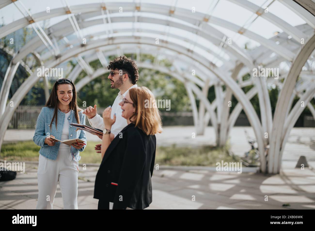 Business associates brainstorming ideas in an outdoor meeting at urban ...