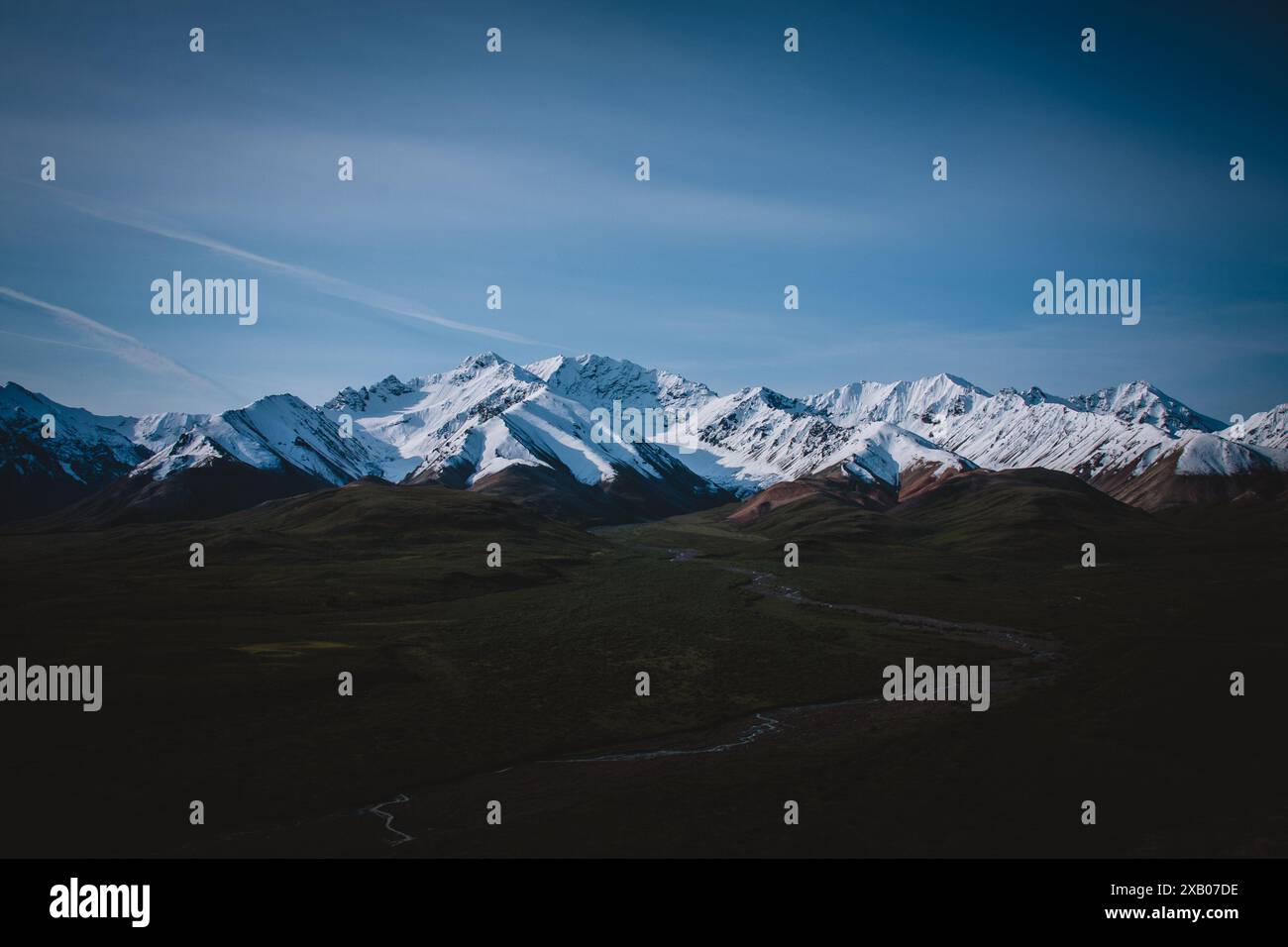Witness the breathtaking beauty of Alaskan mountains and a winding ...