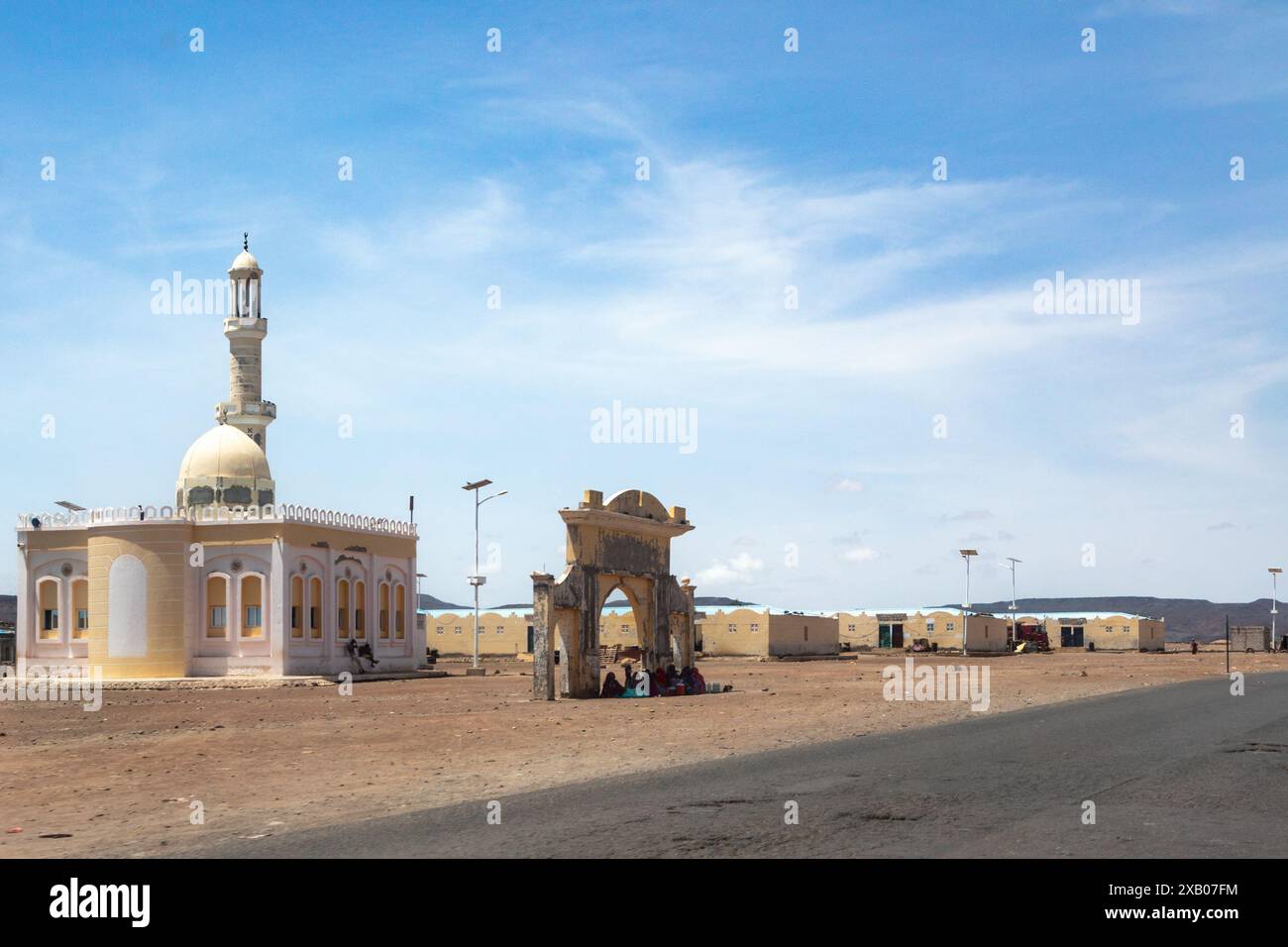 Yellow mosque with arch standing in the desert, Arta region, Djibouti ...