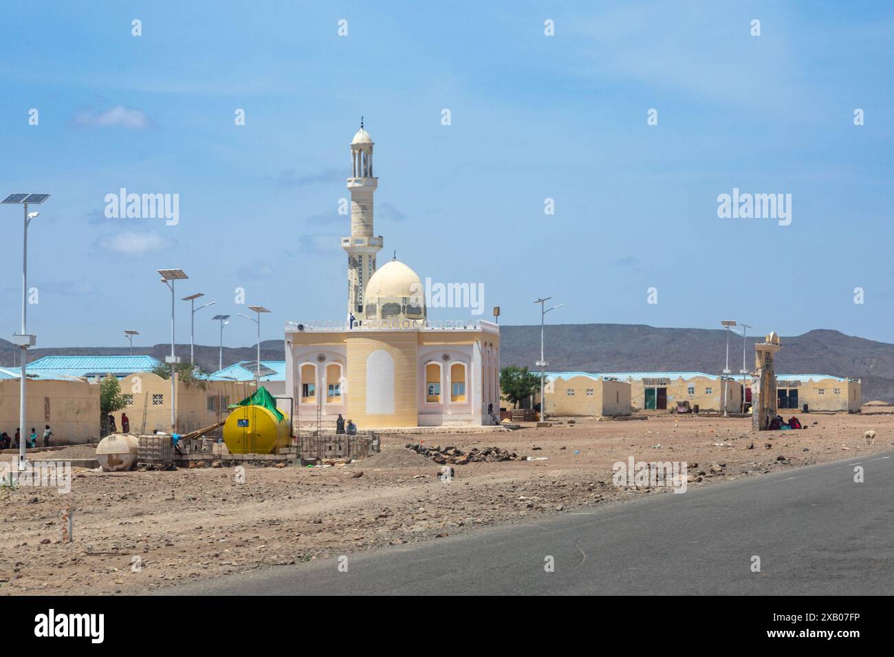 Yellow mosque with arch standing in the desert, Arta region, Djibouti ...