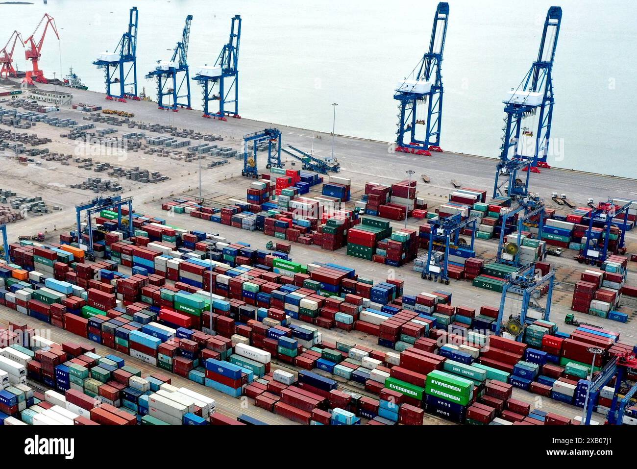 SHISHI, CHINA - JUNE 9, 2024 - Transport vehicles shuttle back and ...