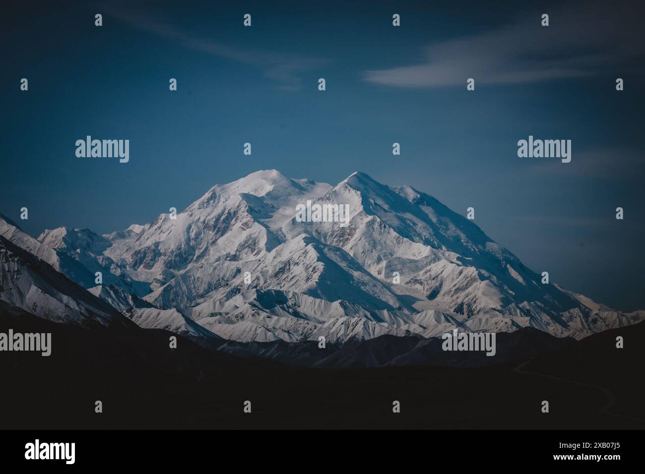 Capture the awe-inspiring majesty of Alaska's snow-capped mountains ...