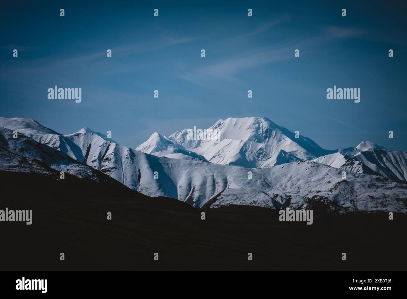 Capture the awe-inspiring beauty of Alaska's snow-capped mountains ...