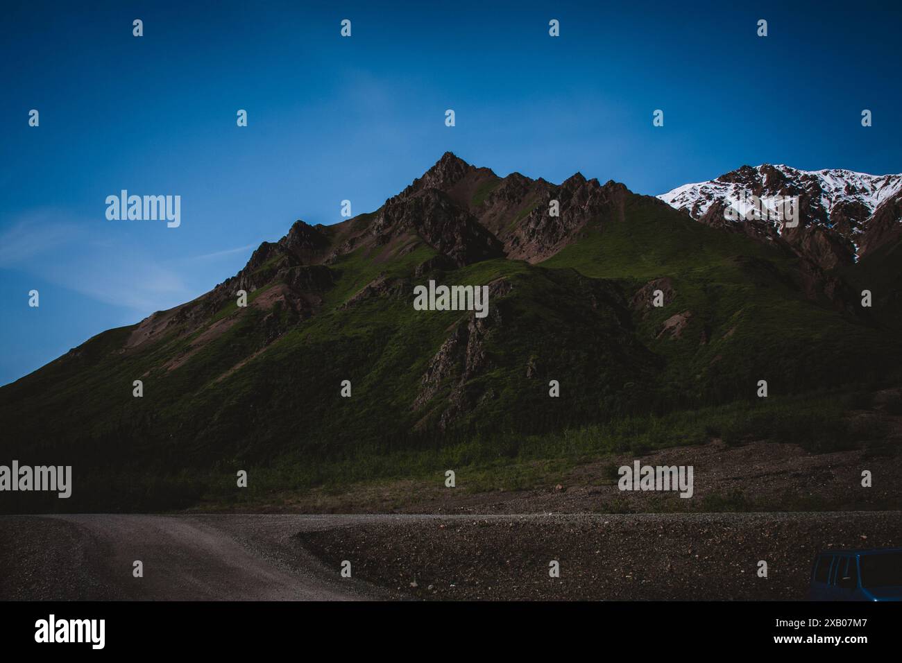 Capture the awe-inspiring beauty of Alaska's rugged mountains under a ...