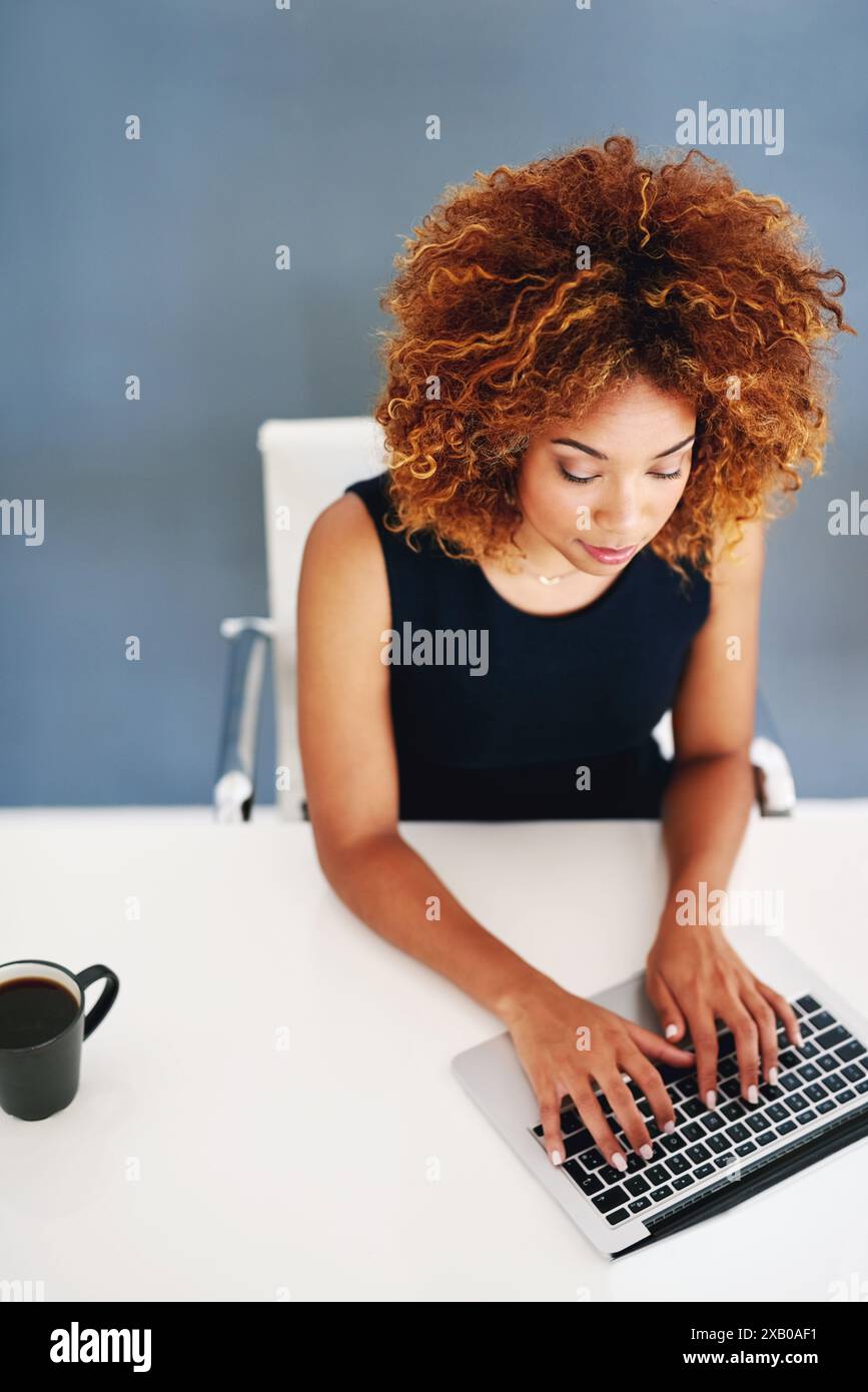 Business, keyboard and black woman with laptop, employee or research ...