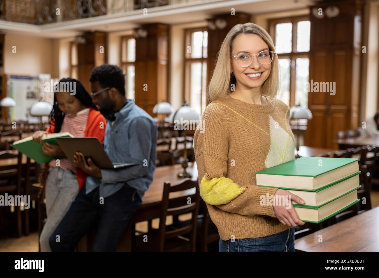 Group of young people in the library looking busy and involved Stock ...