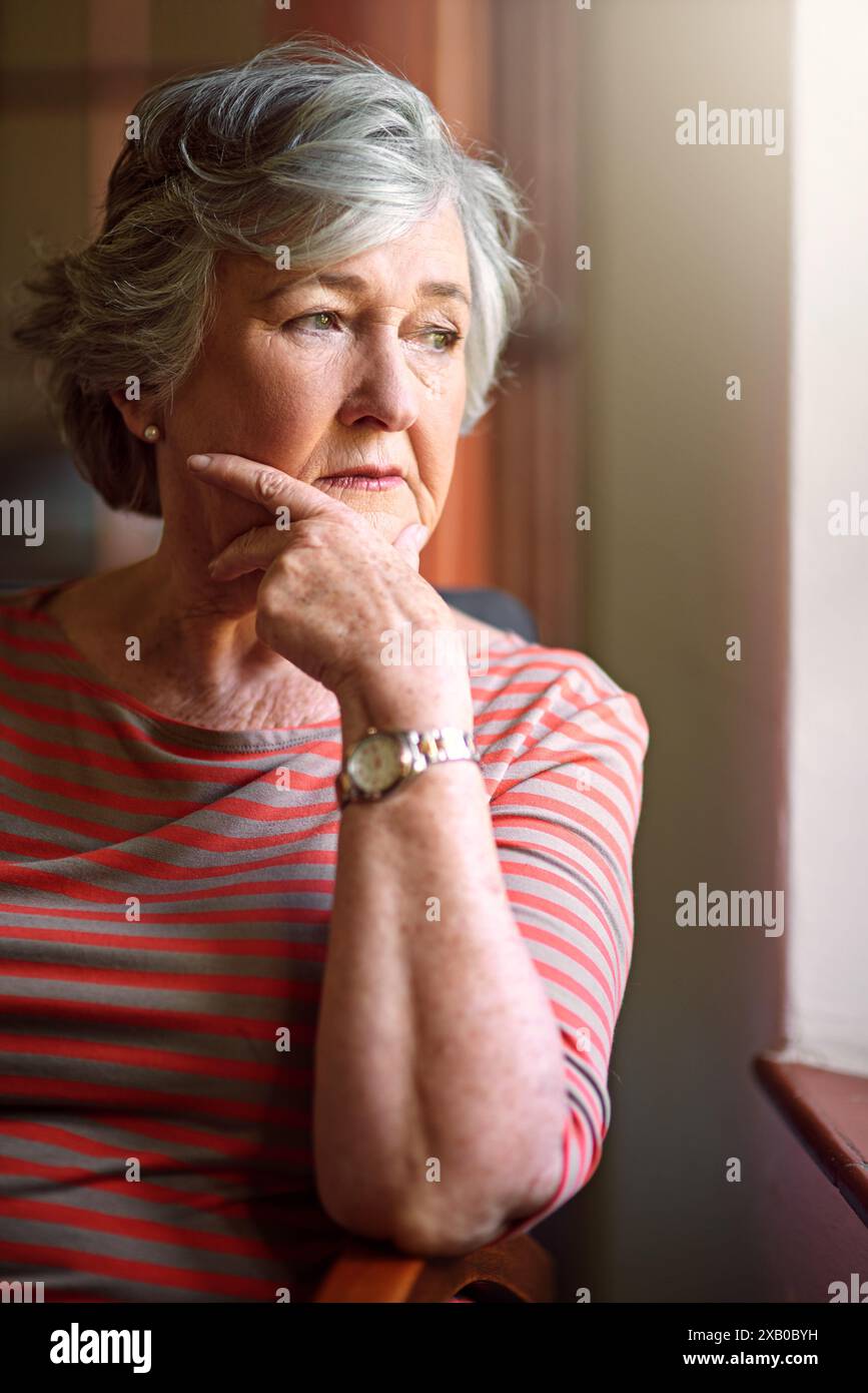 Thinking, depression and senior woman in home living room to remember memory, stress or ...