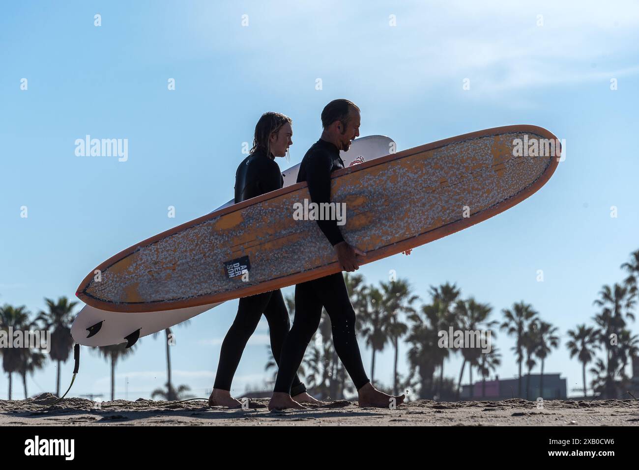 Surfers in Lockstep Stock Photo - Alamy