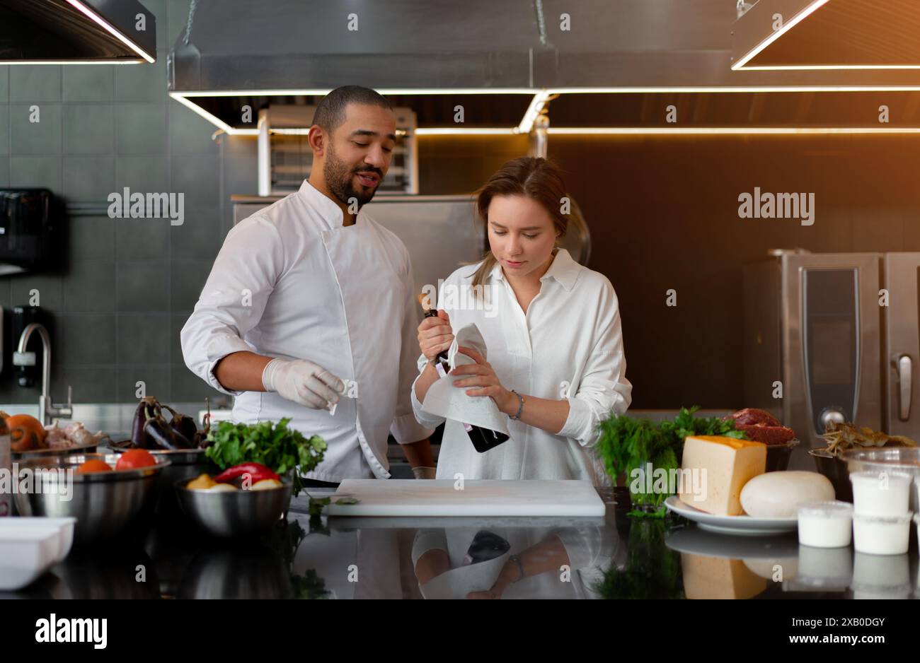 Two diverse female chefs preparing hi-res stock photography and images ...