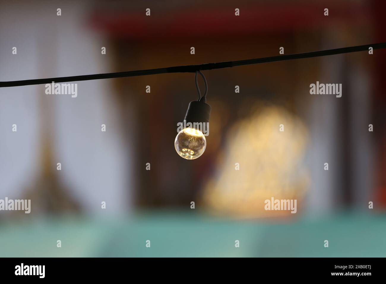 A light bulb hanging on the railing, Hanging bulb set with multiple ...