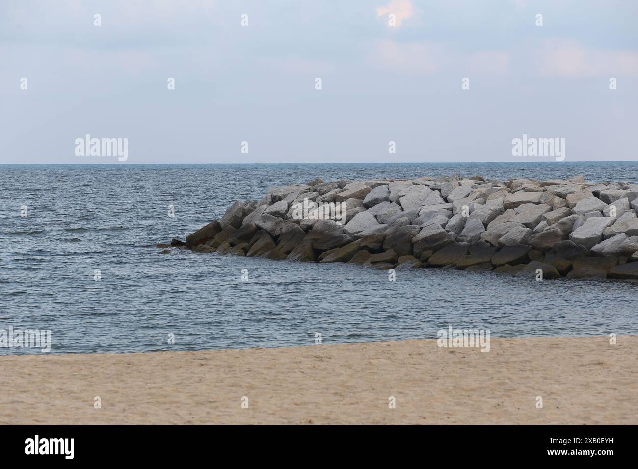 Stone wall of breakwater in sea Coastal areas with strong waves and ...