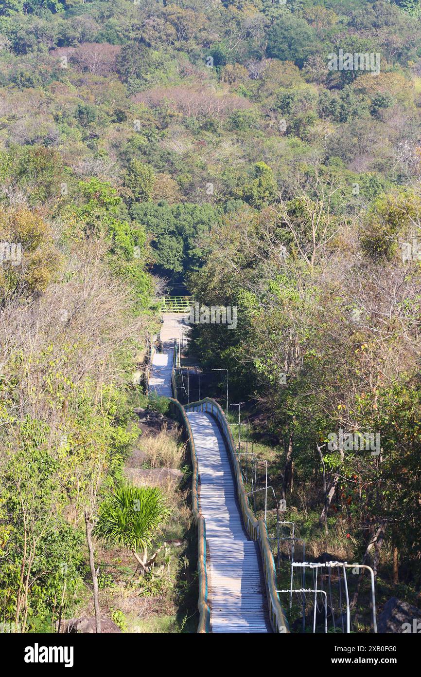 A walkway with tall stairs to climb up to the top of the mountain with ...