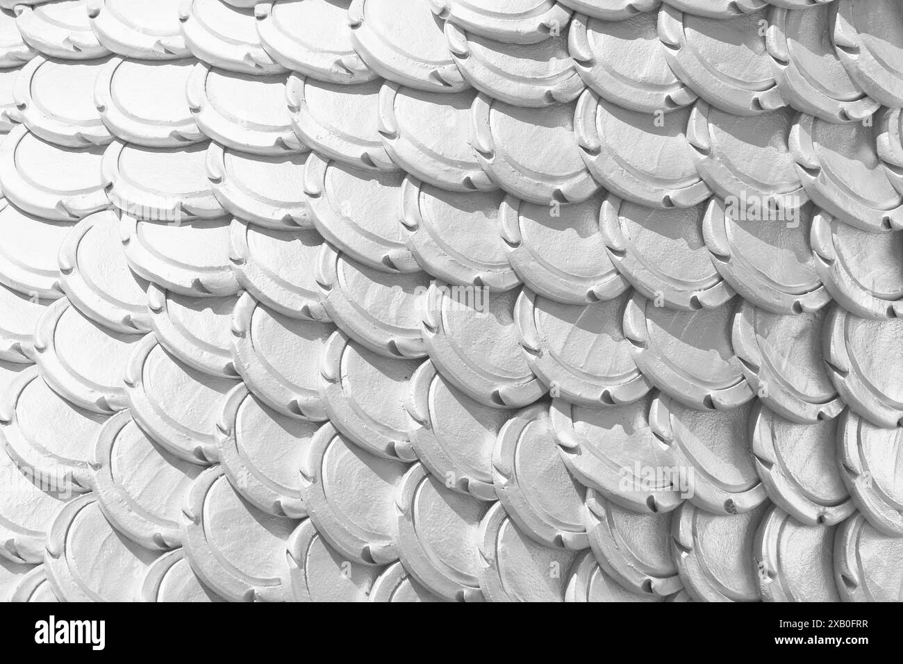 White patterns of stucco shaped like fish scales, Background of stacked ...