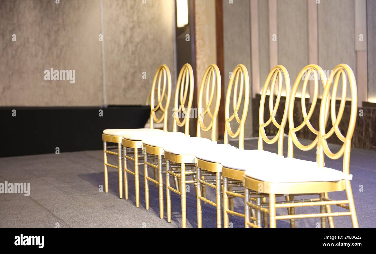 Empty chairs at the front of the meeting room, Empty golden color of ...
