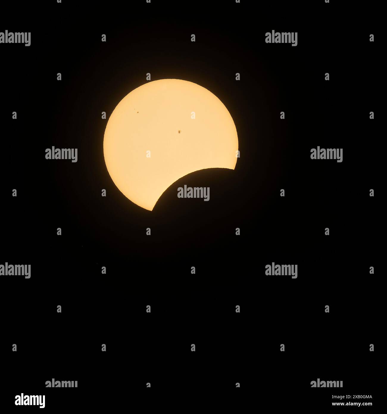 The beginning of the total solar eclipse as the moon moves across the ...