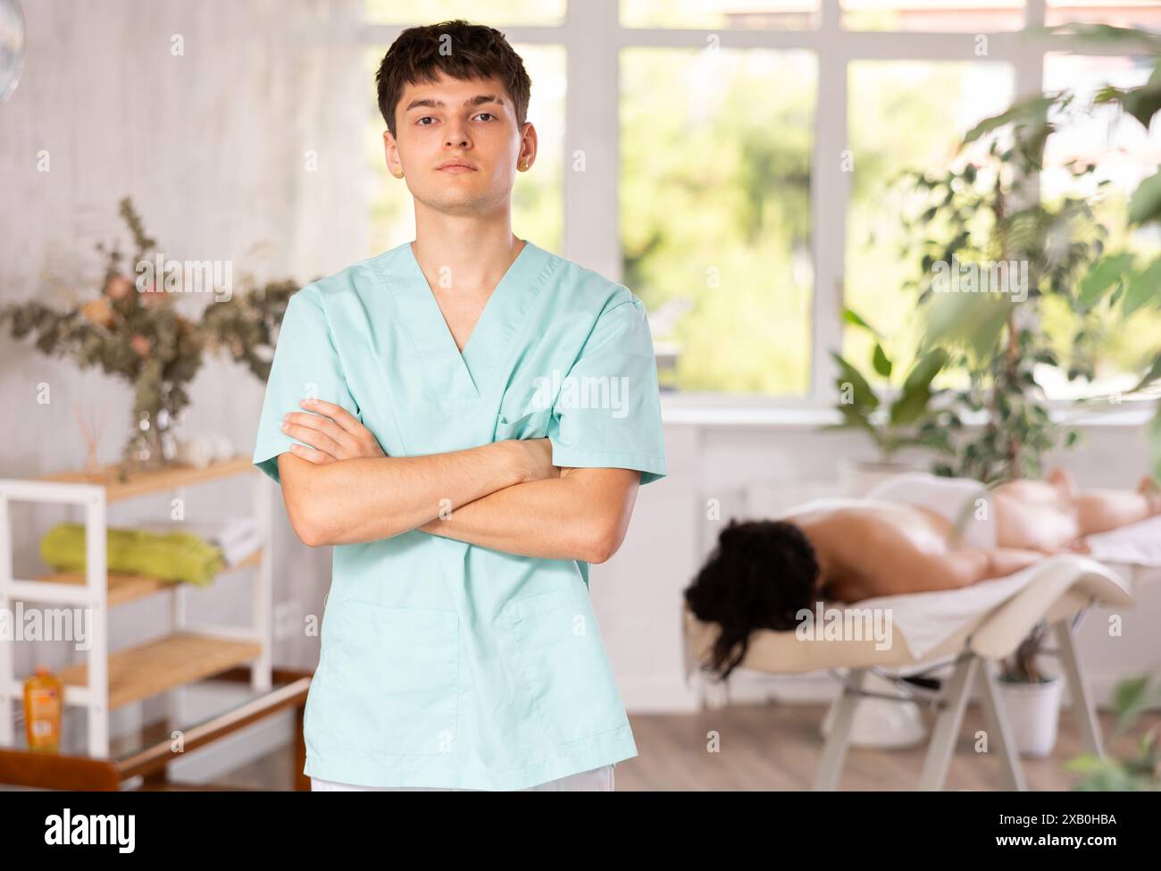 Portrait of happy male masseur in spa salon Stock Photo - Alamy