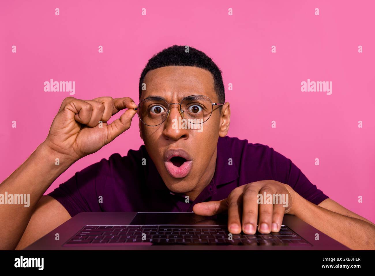 Photo portrait of handsome young guy typing keyboard frightened wear ...