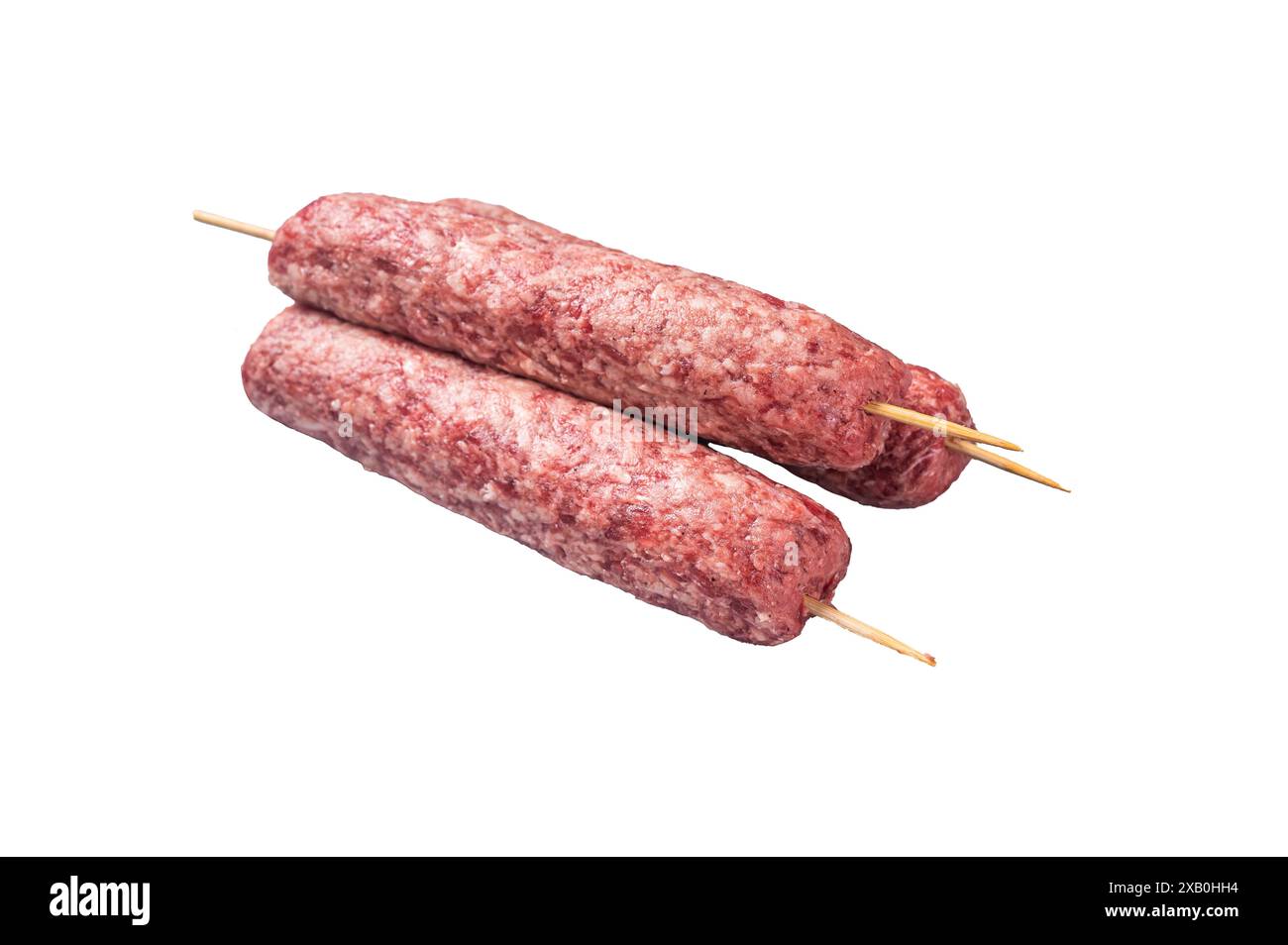 Raw kofta or lula kebabs skewers on butcher board. Isolated on white ...